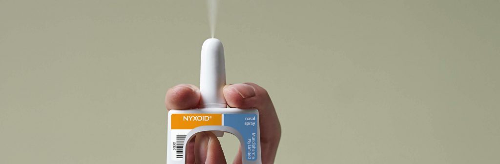 MUN5841_Nyxoid Retouch spray with hand HR (2) – NYXOID® Nasal Spray